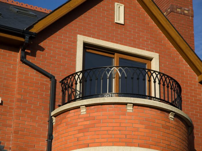 Providing Gothic style balconies with two half-circle balconies on the ...
